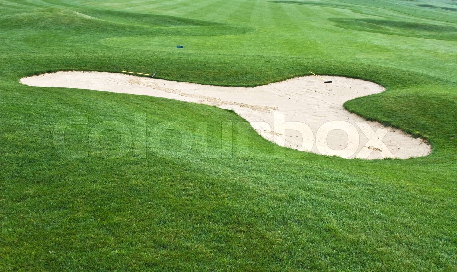 Sand trap on the golf course | Stock image | Colourbox