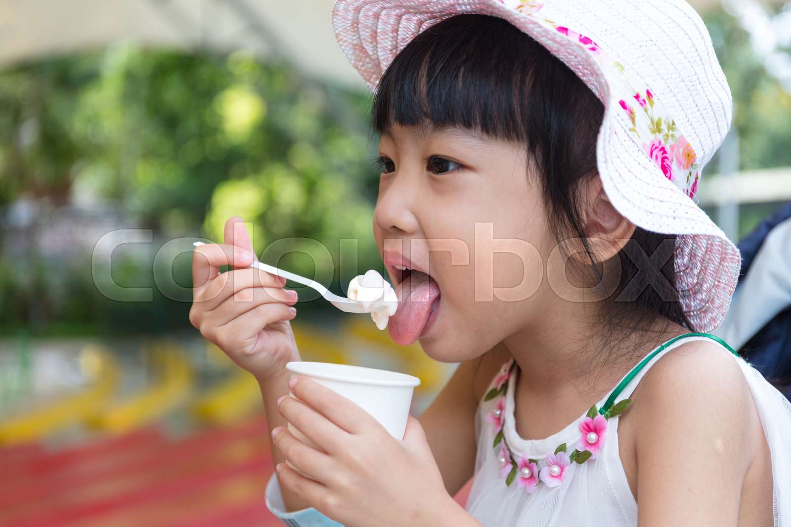 Asian Chinese little girl eating ice cream | Stock image | Colourbox