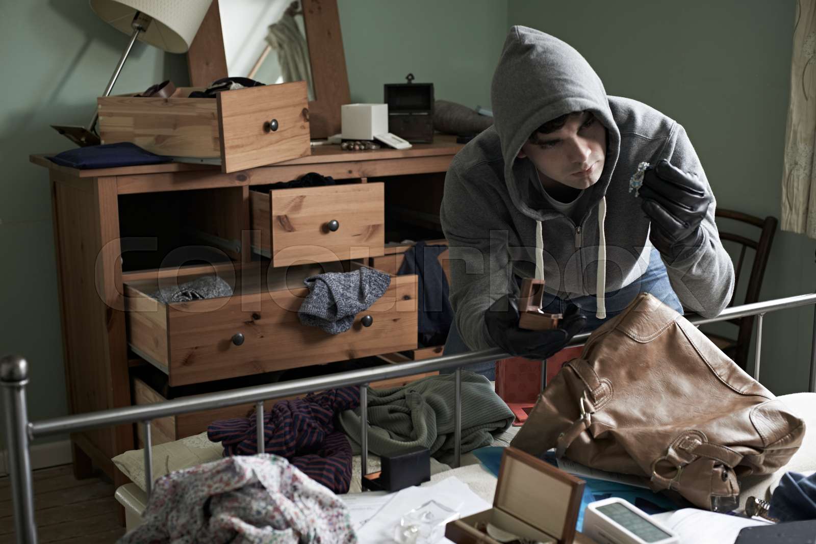 Burglar Stealing Items From Bedroom During House Break In | Stock image ...