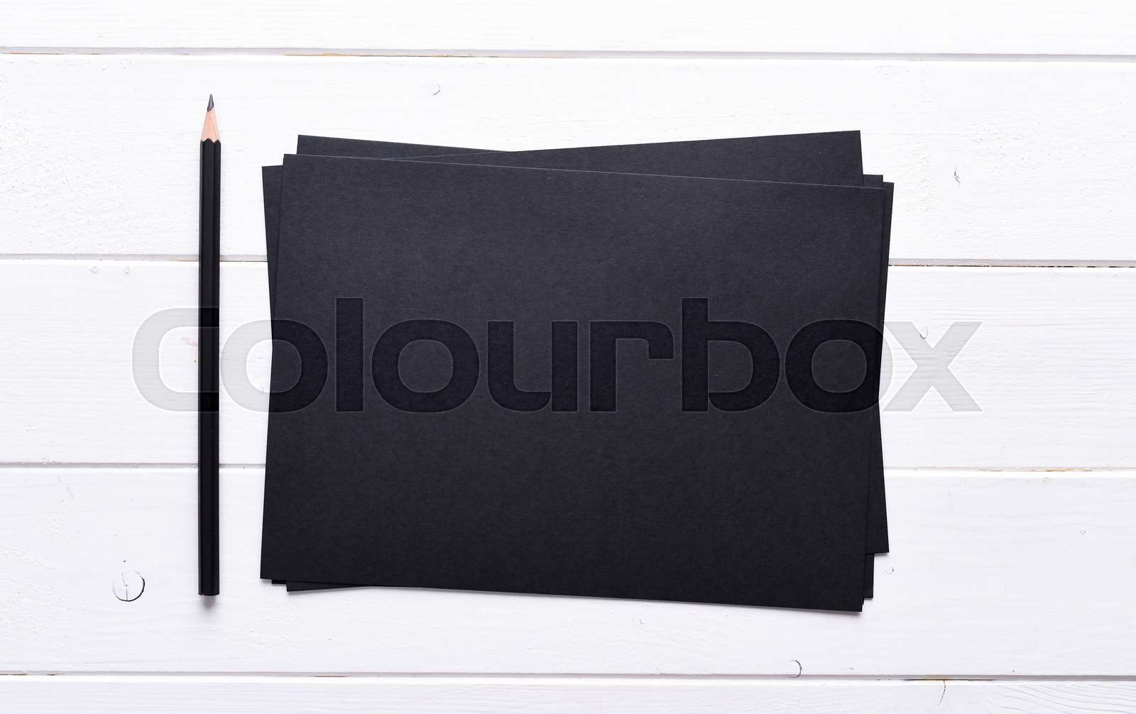 stack of black paper with pencil | Stock image | Colourbox