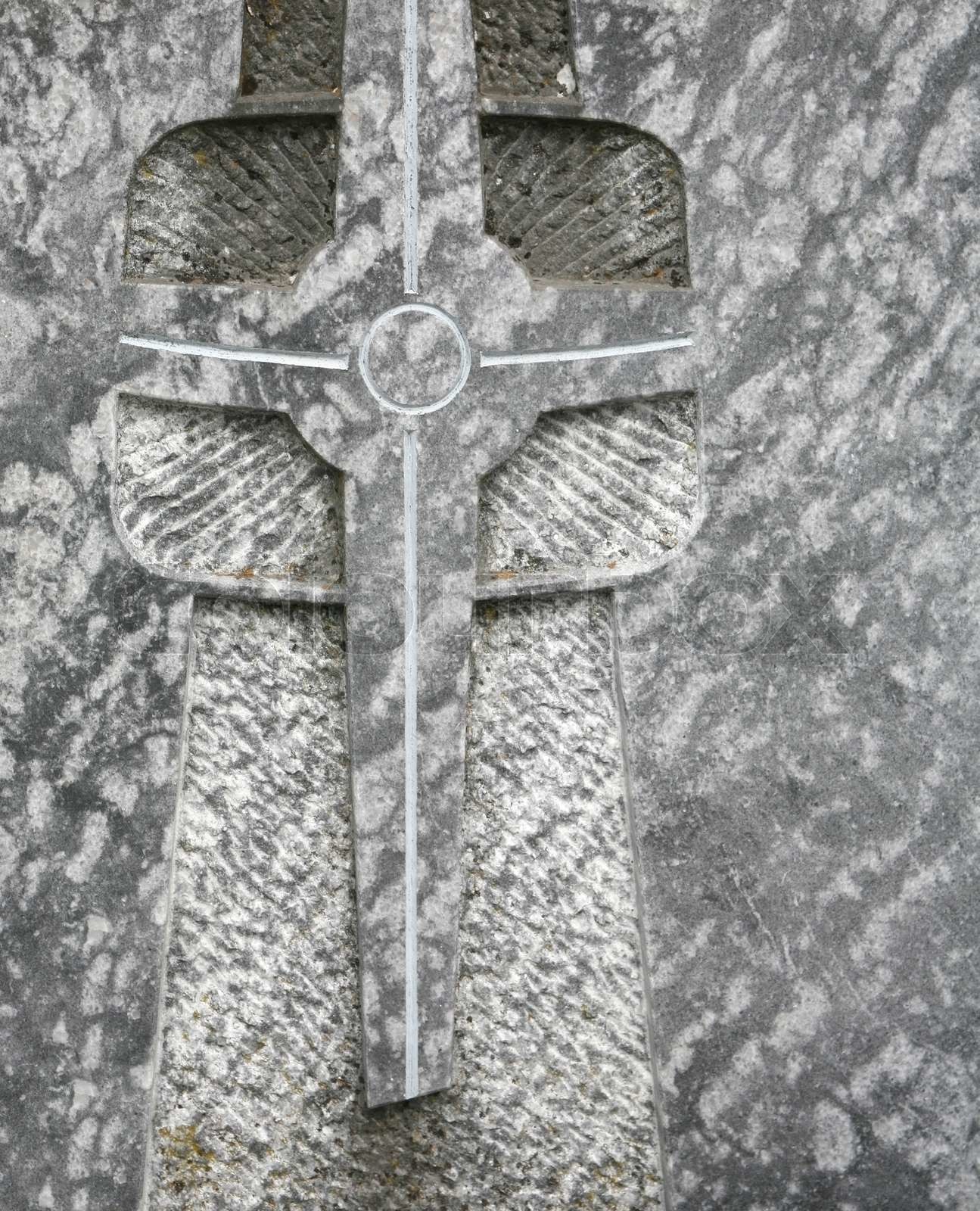 detail of a gravestone showing a cross | Stock image | Colourbox