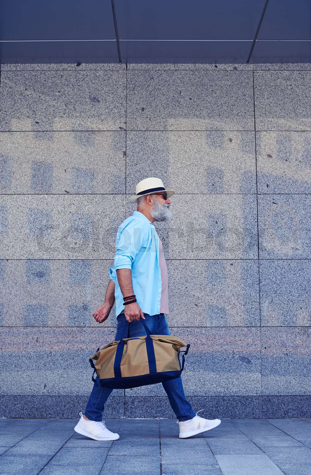 Man walking with bag | Stock image | Colourbox
