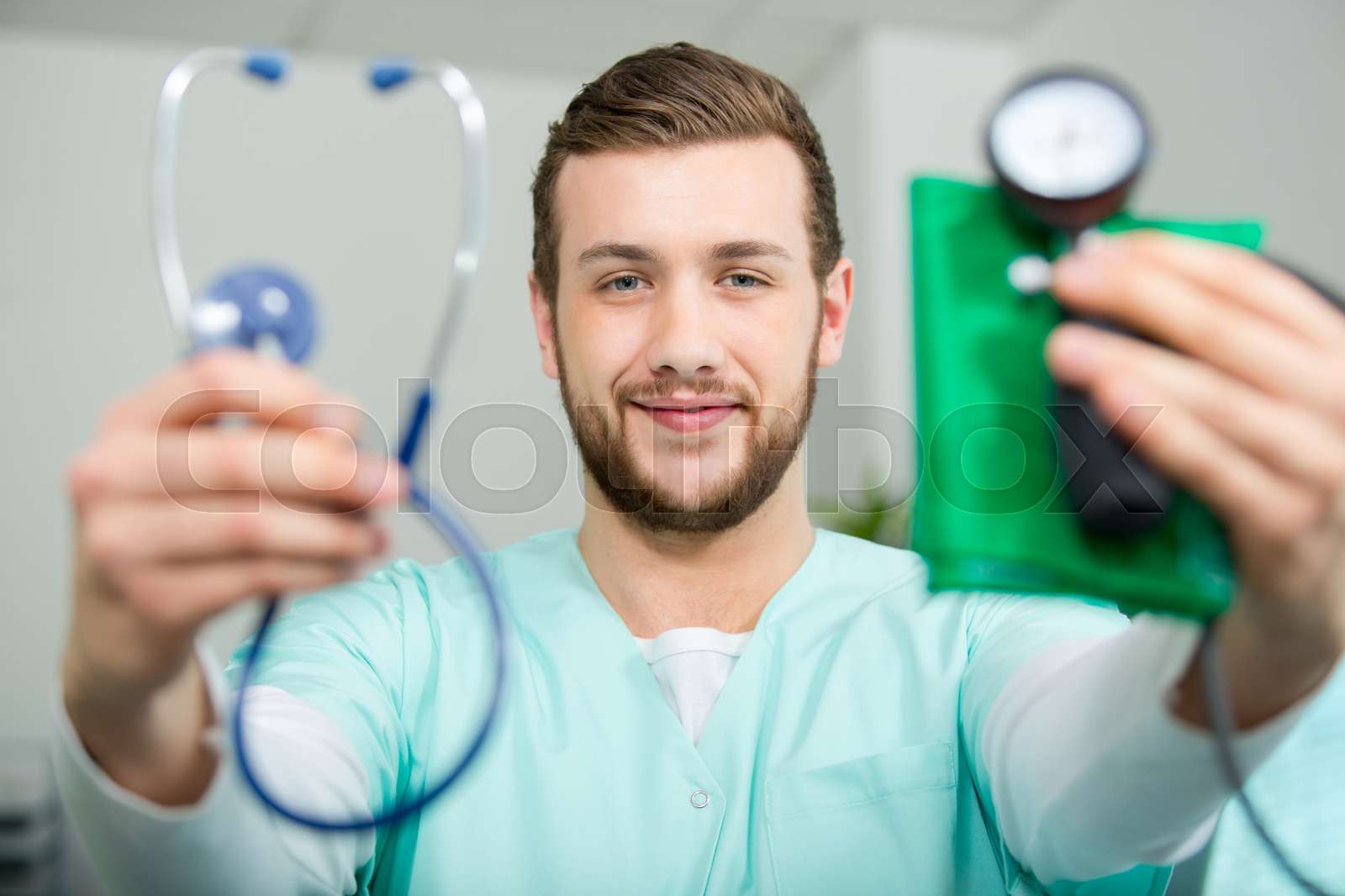medic showing stethoscope and blood pressure testing kit | Stock image ...