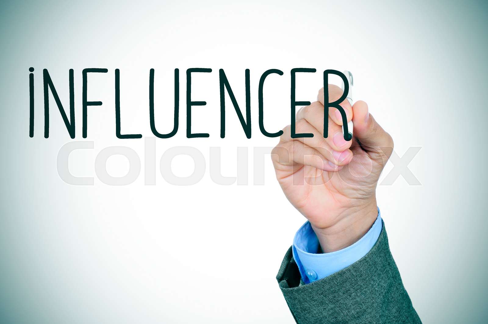 man writing the word influencer | Stock image | Colourbox