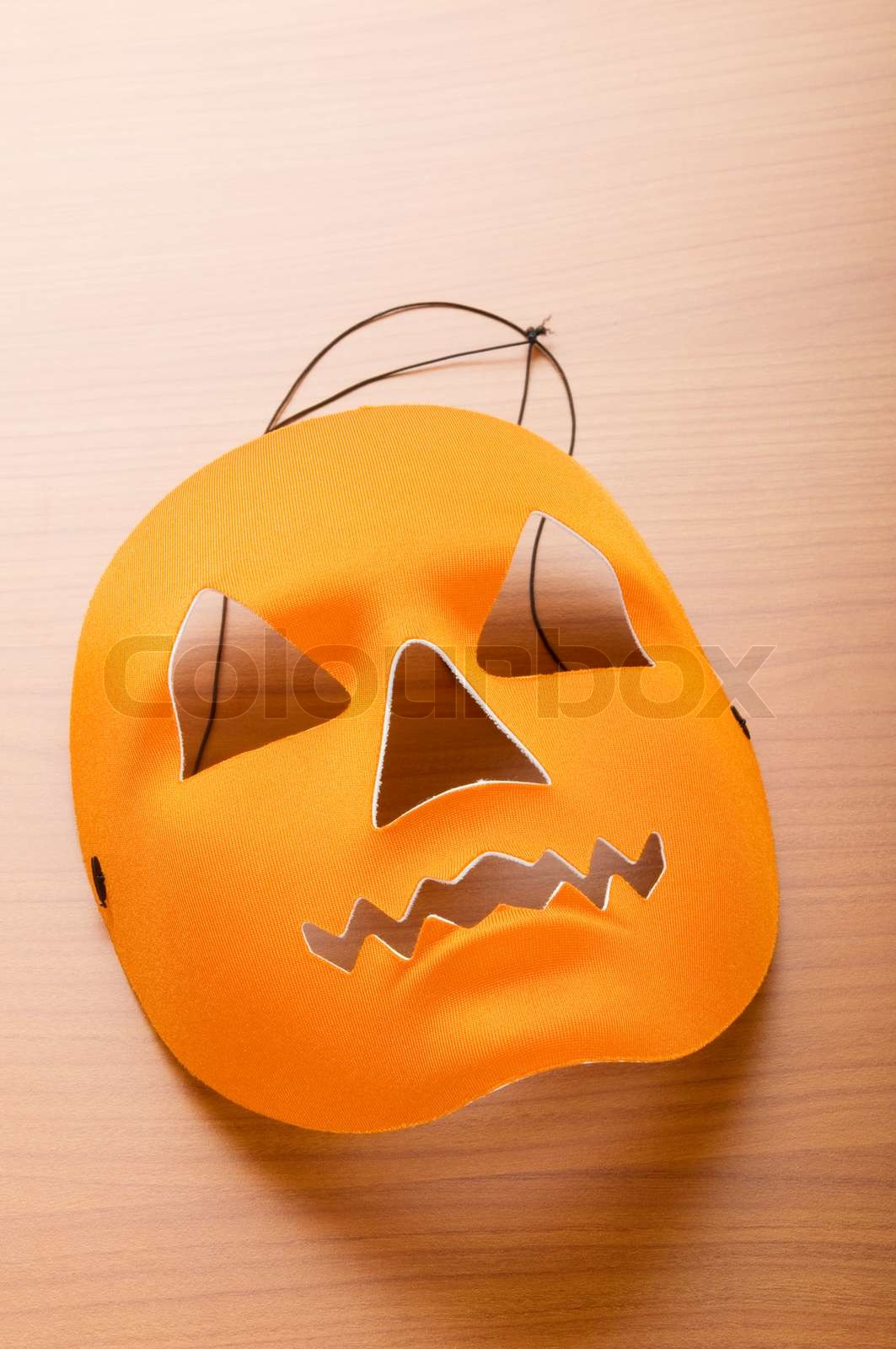 Orange scary halloween mask as holiday concept | Stock image | Colourbox