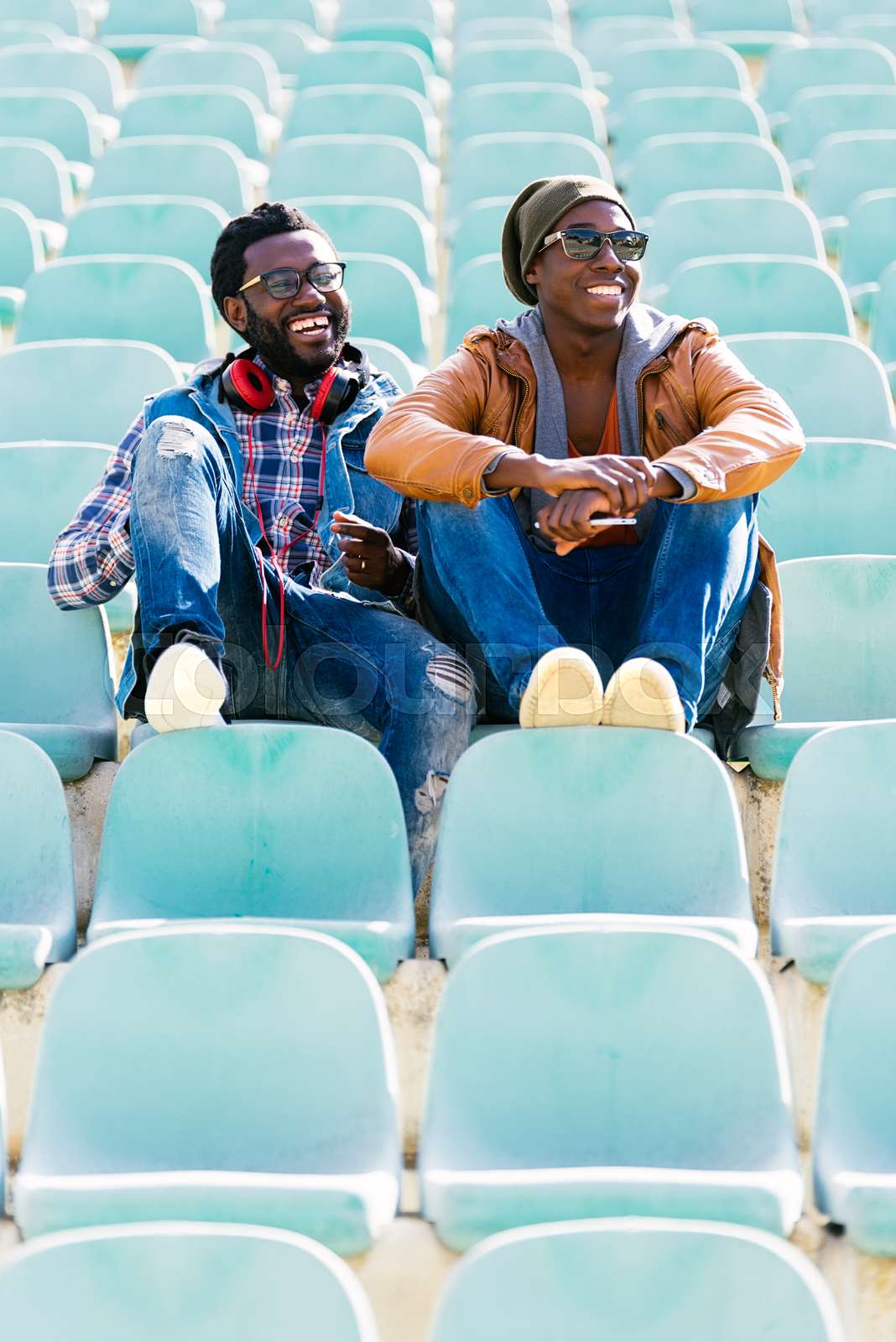 Two black race friends having fun in the park. | Stock image | Colourbox