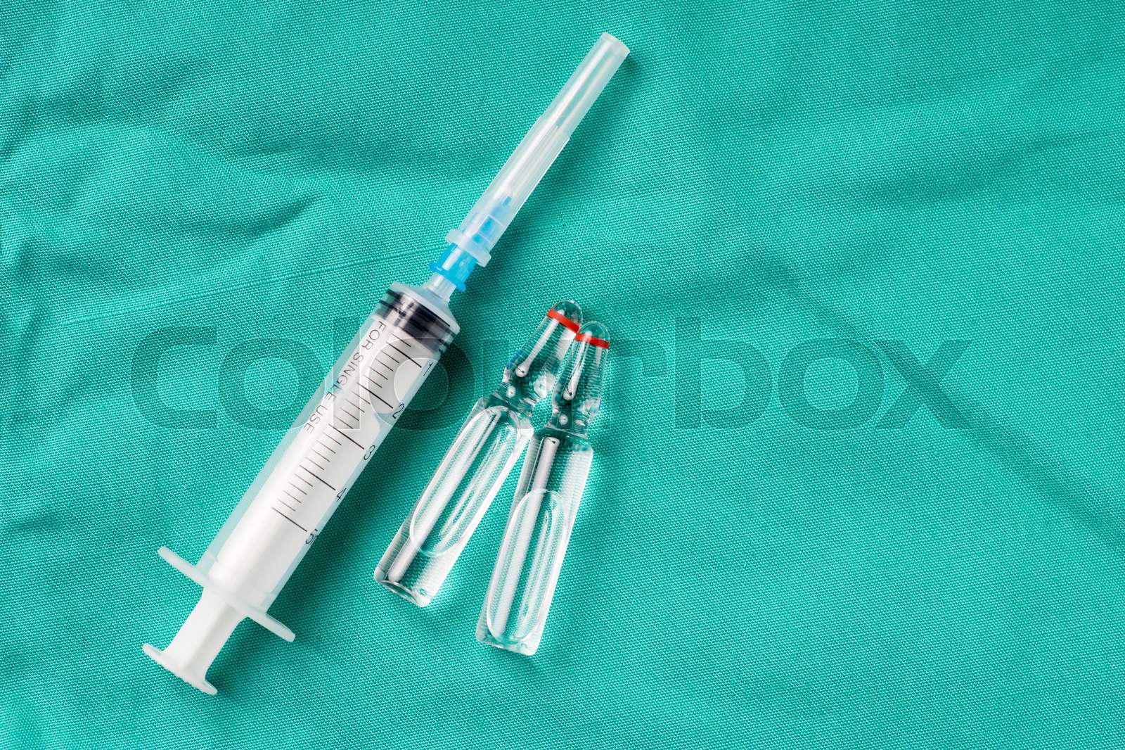 Medical syringe and vials | Stock image | Colourbox