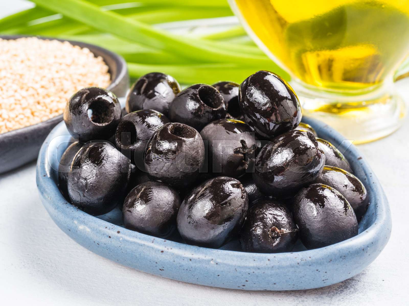 black olives in blue plate | Stock image | Colourbox