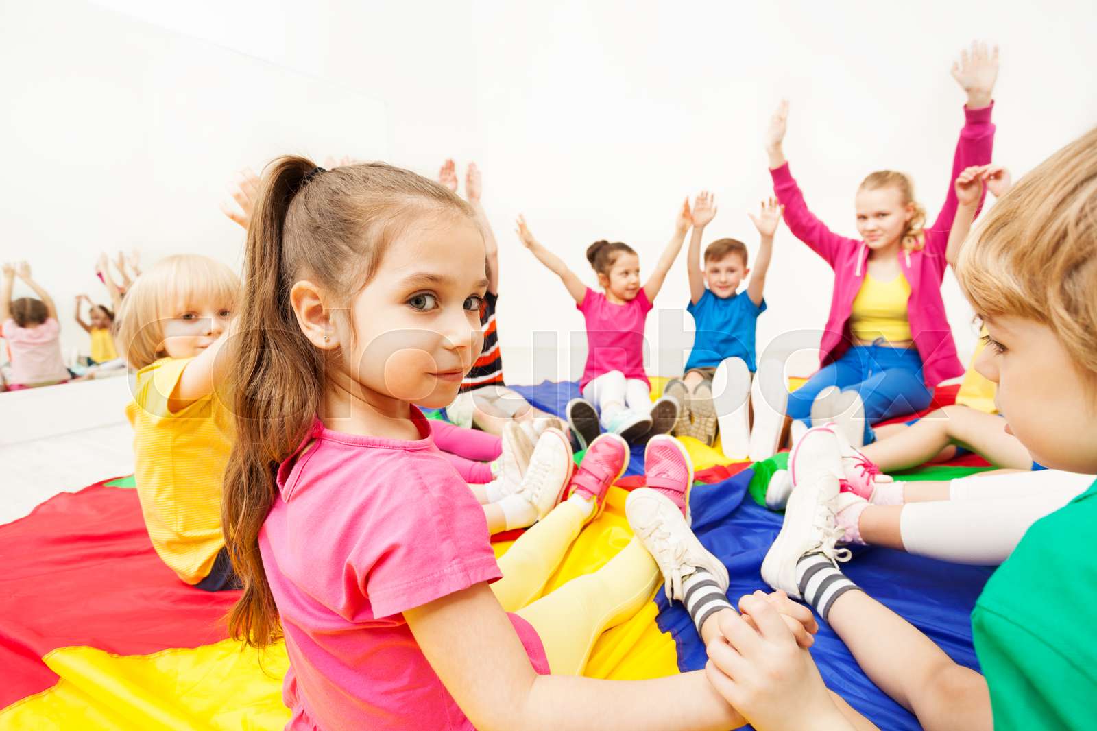 Beautiful girl playing circle games with friends | Stock image | Colourbox