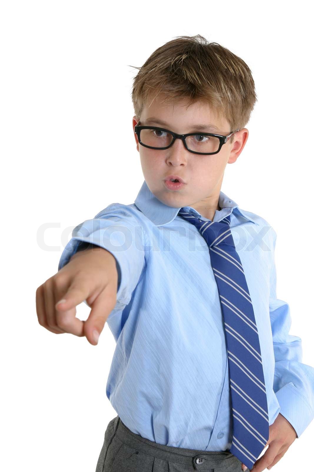 A young boy with arm extended arm pointing his finger | Stock image ...