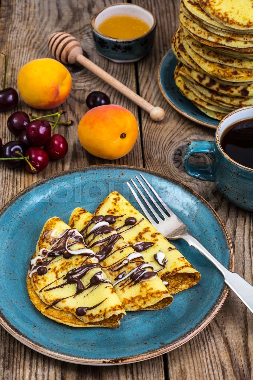 Traditional Russian breakfast pancakes with fruit and honey | Stock ...