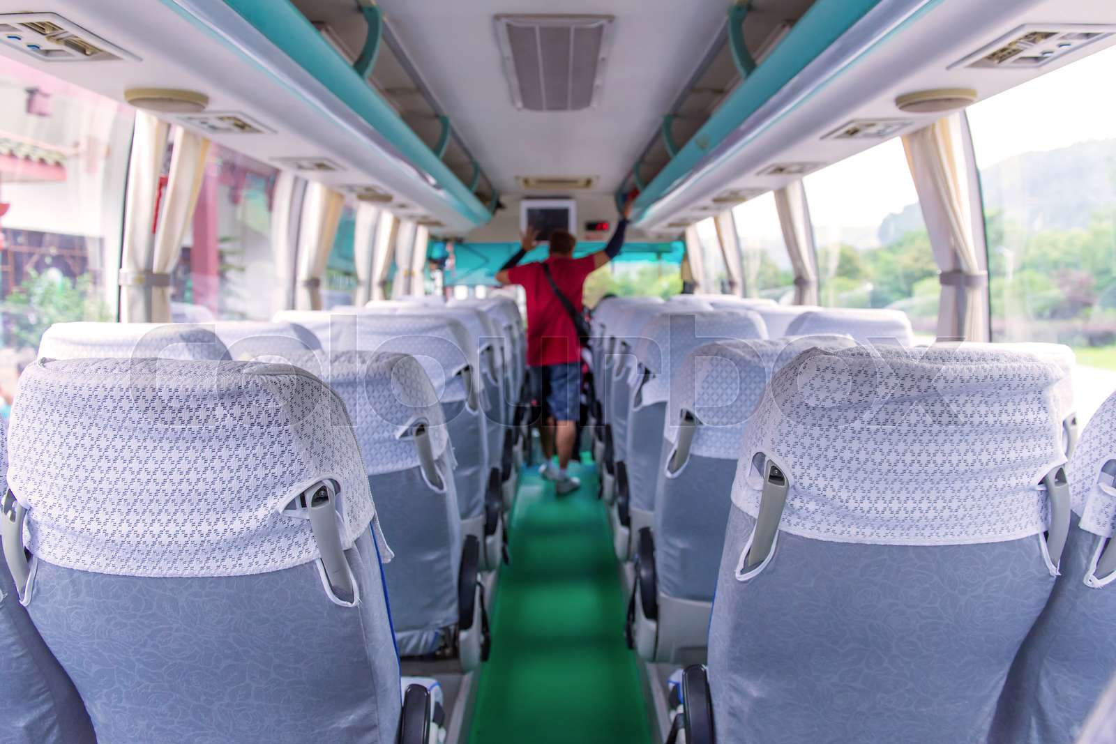 Seat places in back side of modern bus | Stock image | Colourbox