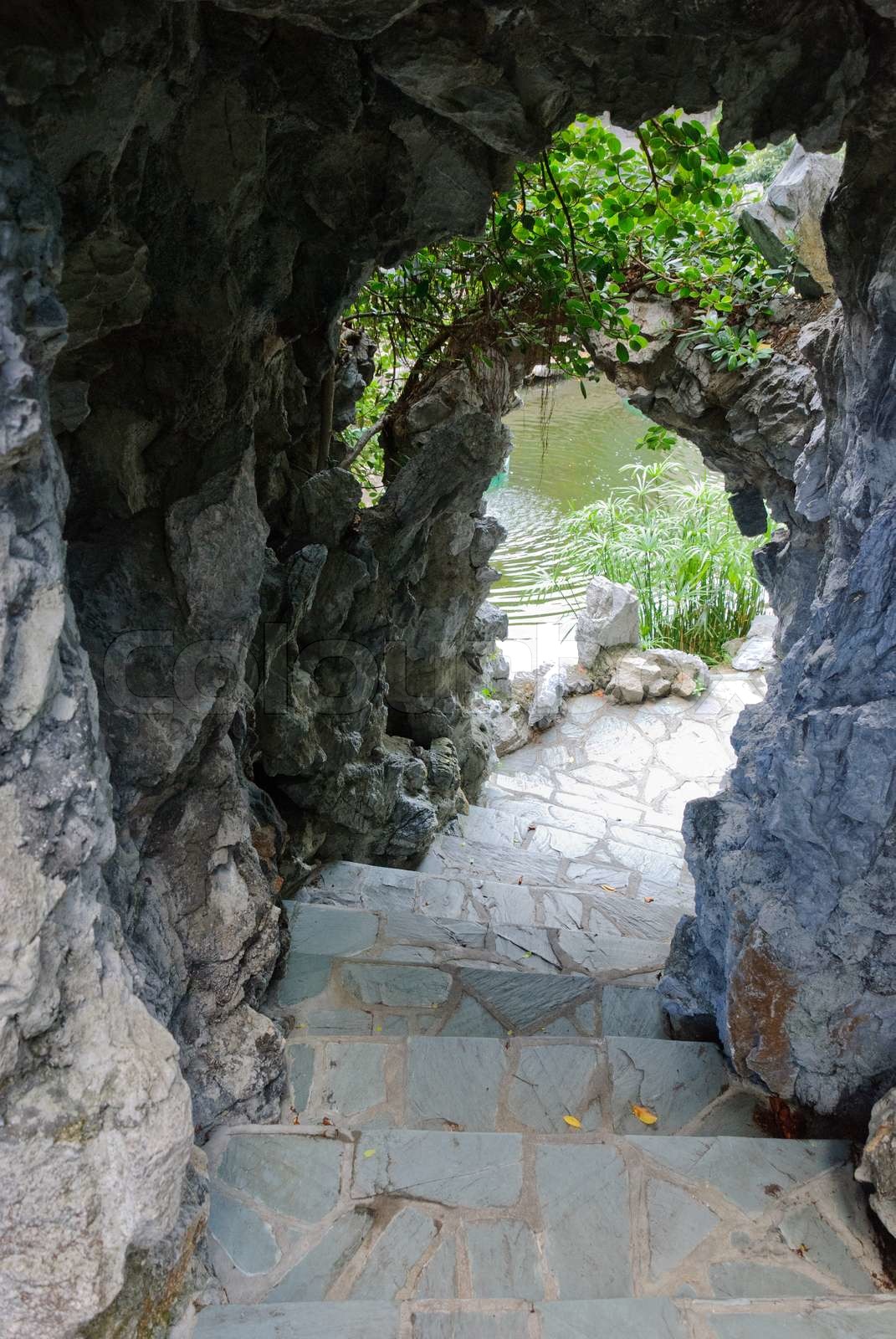 Mystery stone cave with pathway and staircase | Stock image | Colourbox