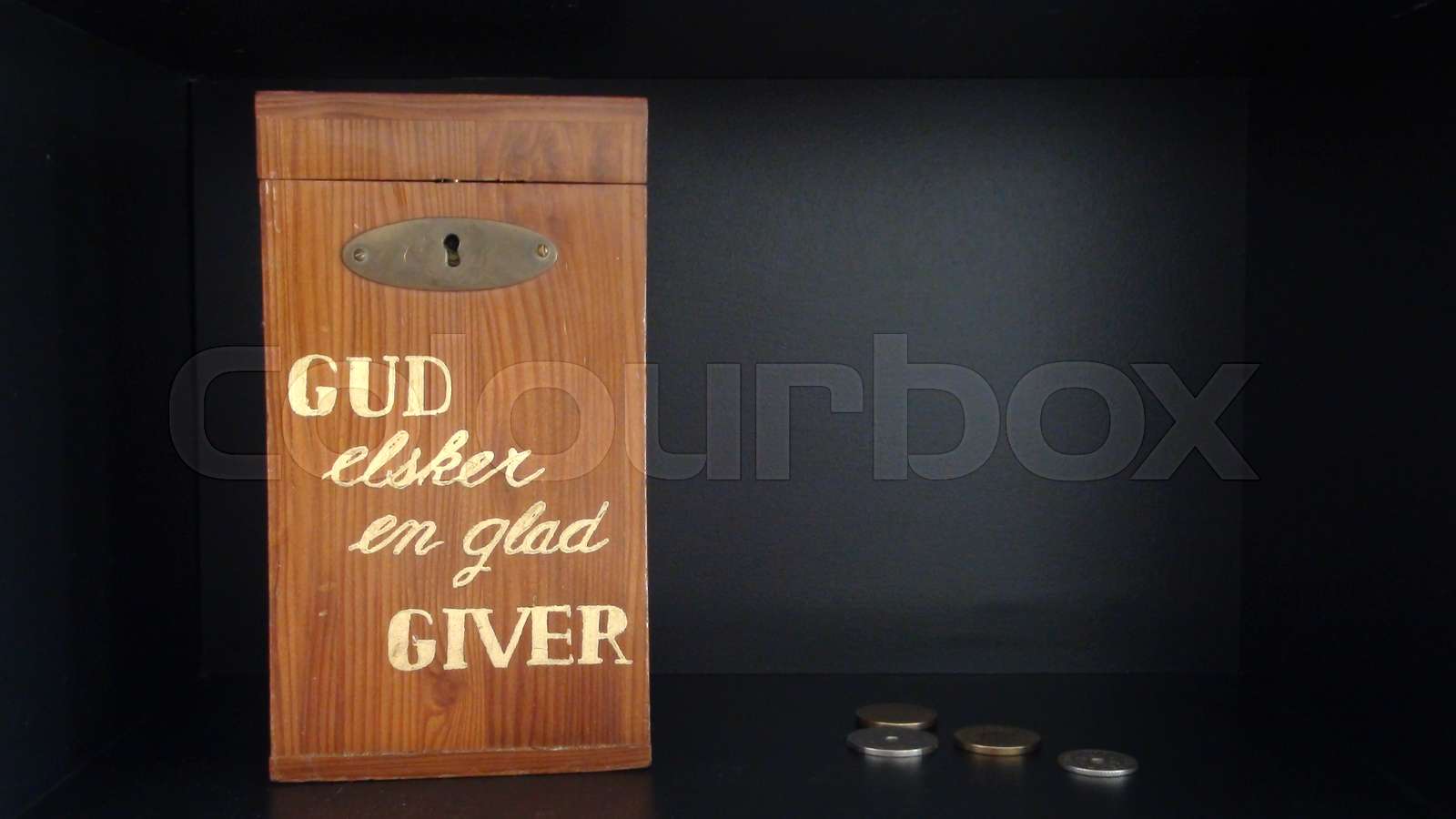 Indsamlingsbøsse - Gud elsker en glad giver | Stock foto | Colourbox