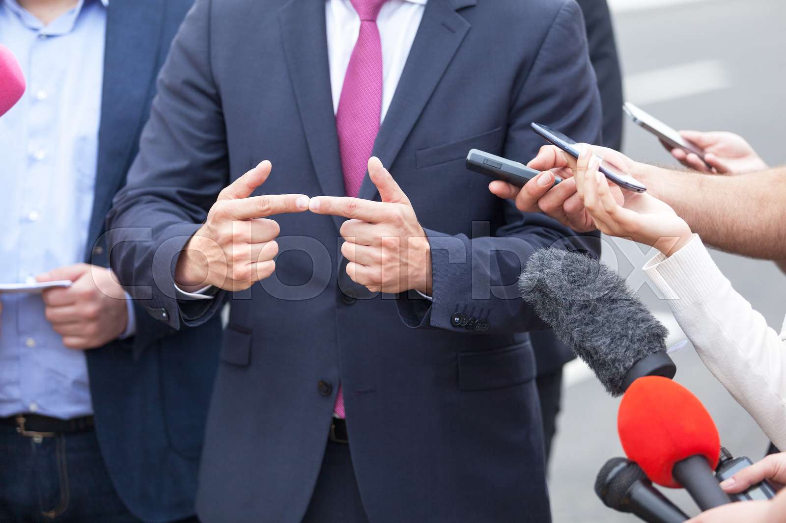 Media interview. Hand gesture. | Stock image | Colourbox