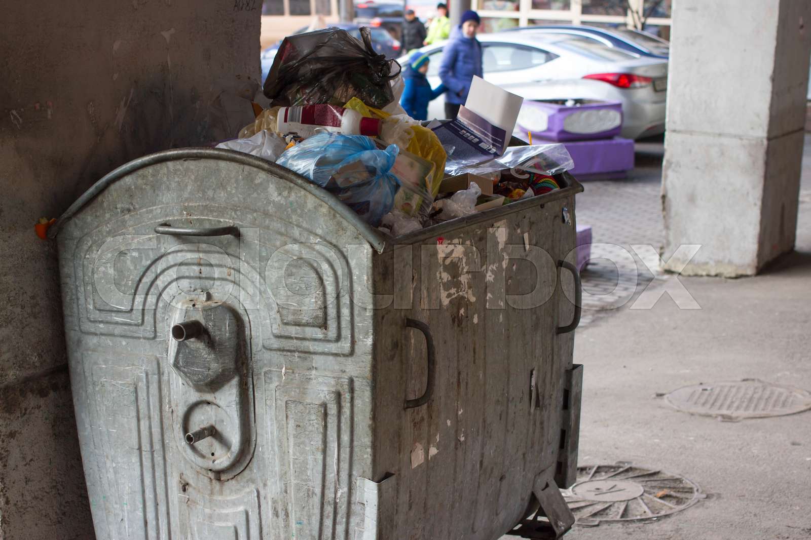 Outdoor trash bin with food waste. Not sorted garbage, yard, stench ...