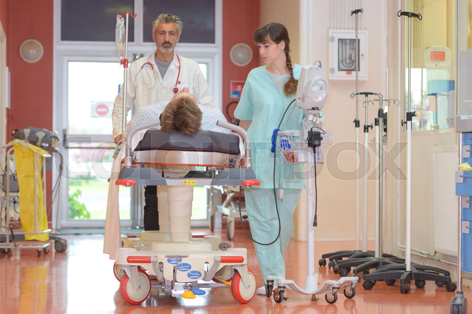 doctor and nurse around patient laying in stretcher | Stock image ...