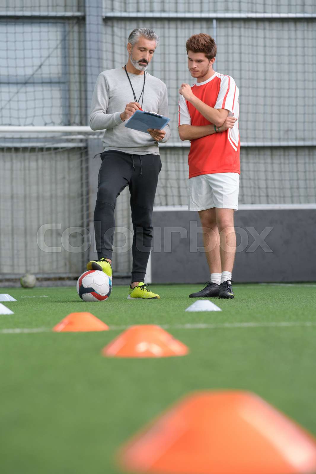 football coach advising young player | Stock image | Colourbox