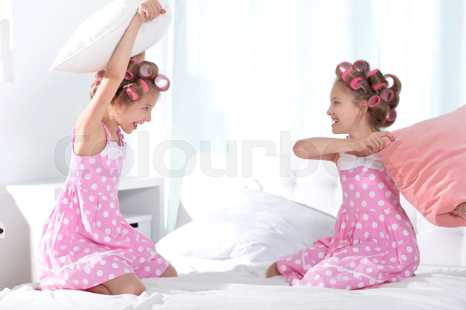 tweenie girls playing with pillows | Stock image | Colourbox