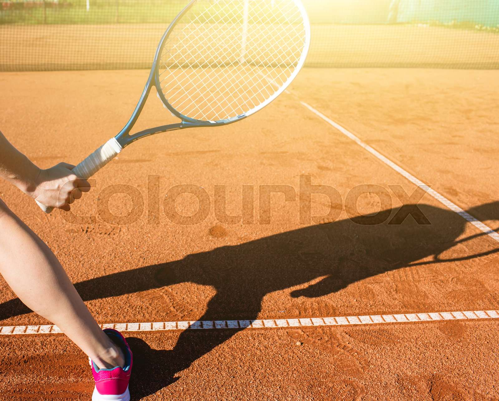 Female hand with tennis racket | Stock image | Colourbox