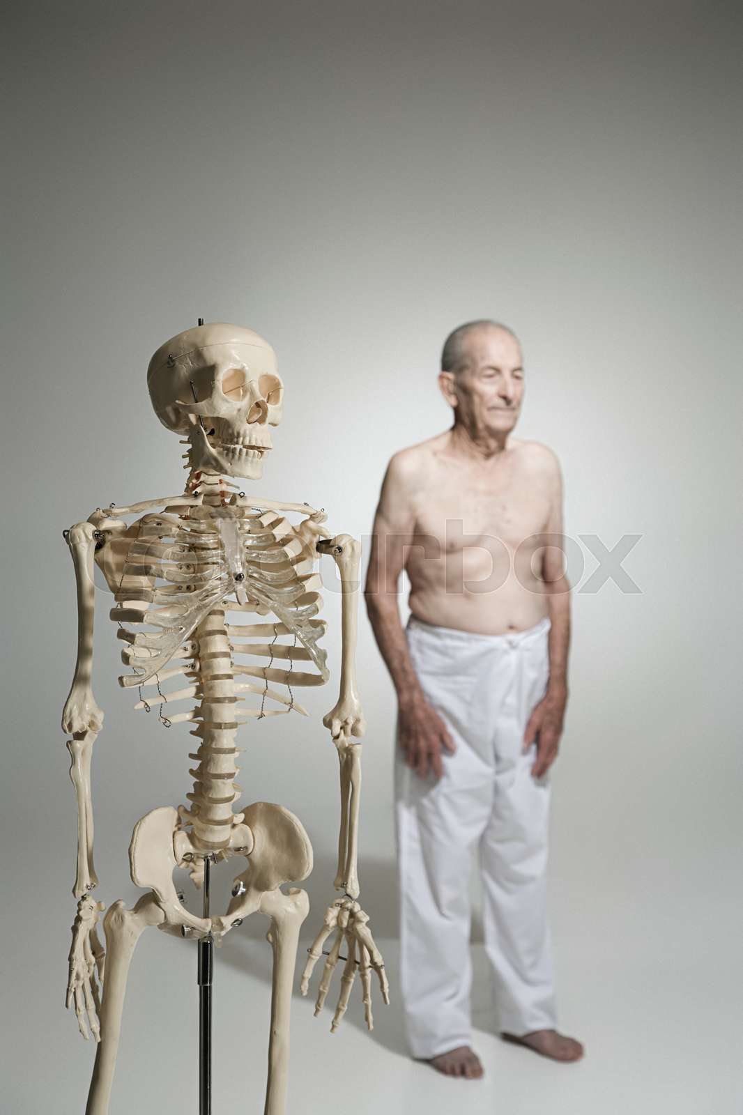 Skeleton and a senior man | Stock image | Colourbox