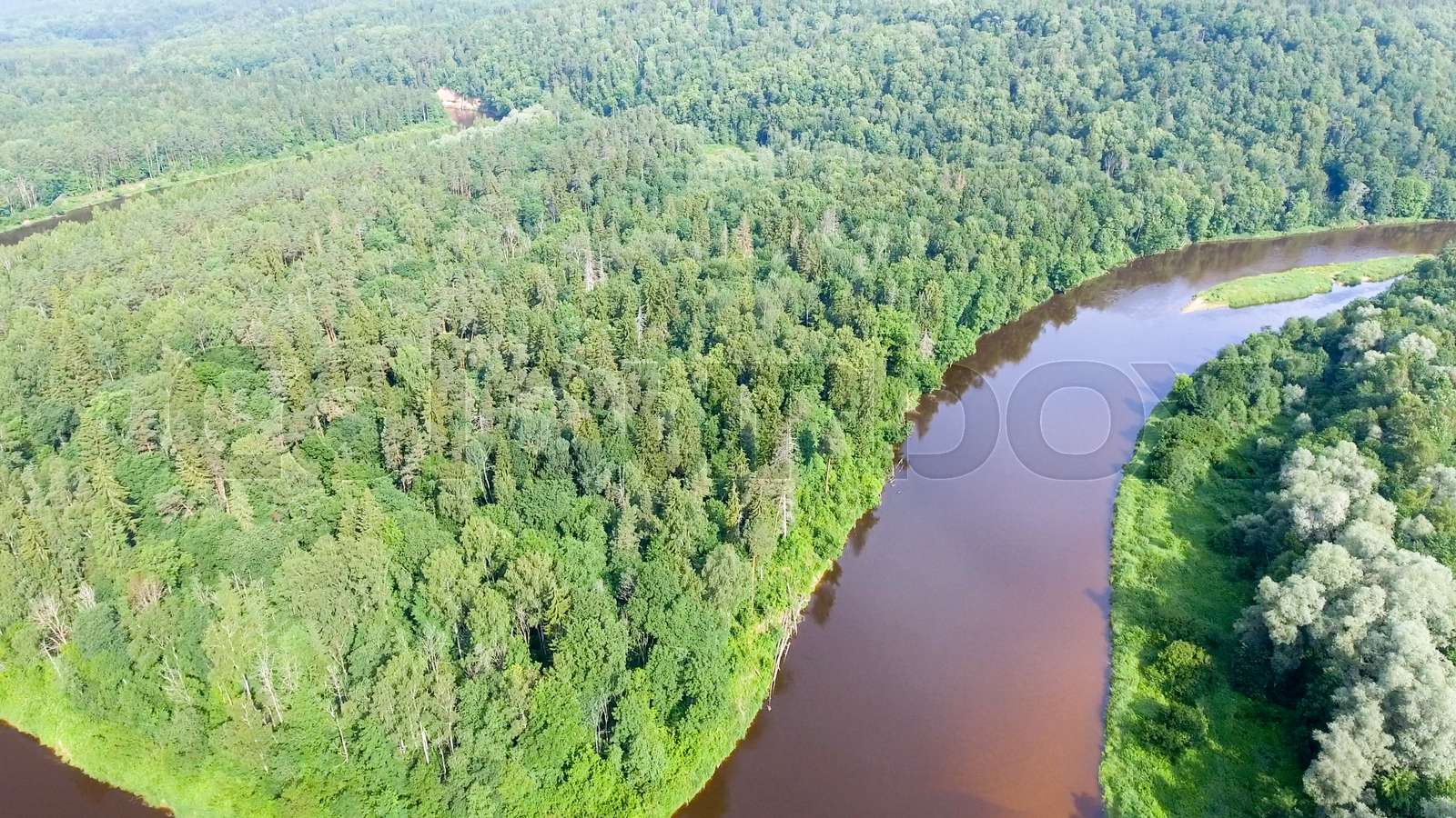 Overhead view of river across the forest | Stock image | Colourbox
