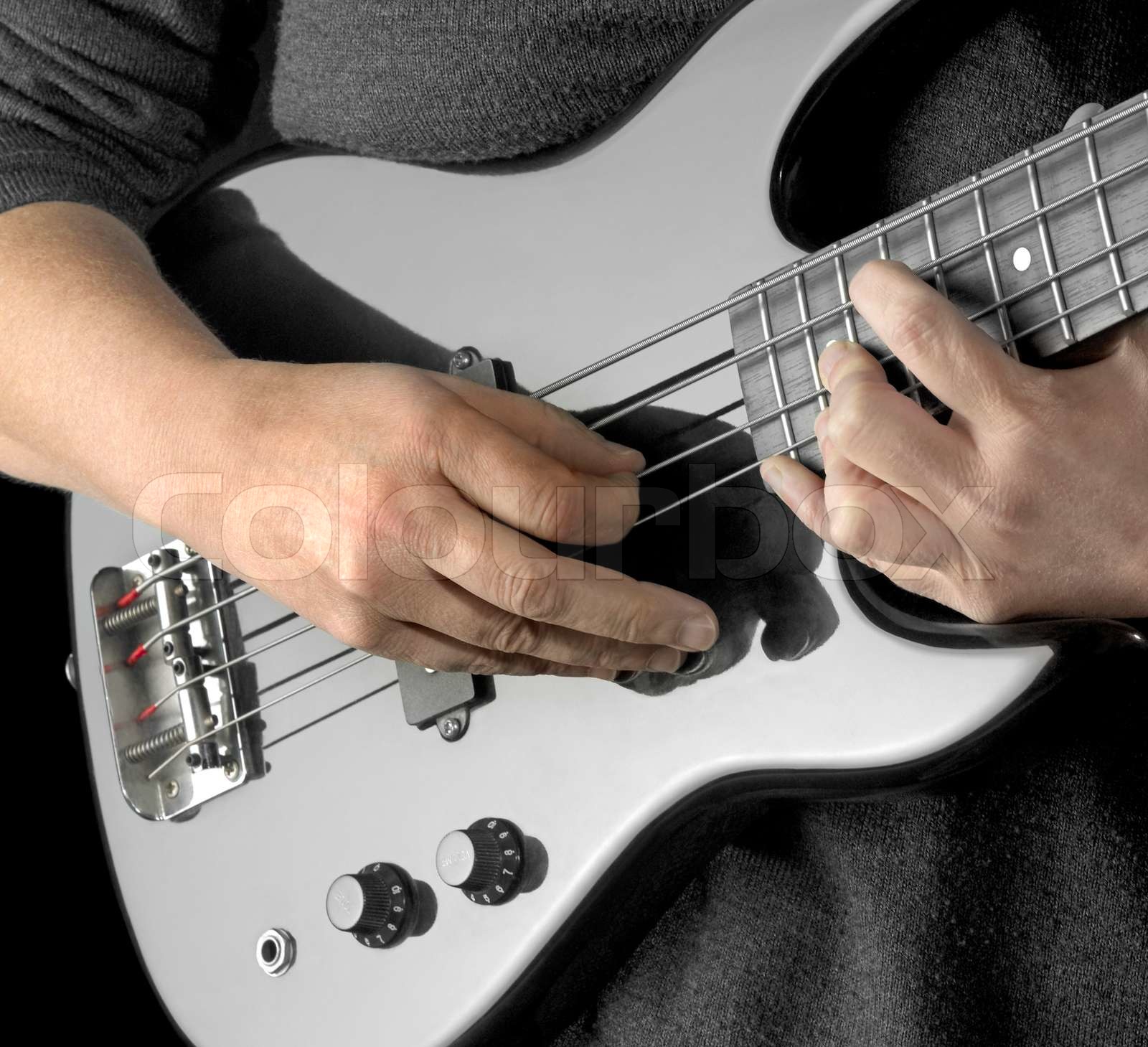 Hands Playing Bass Guitar