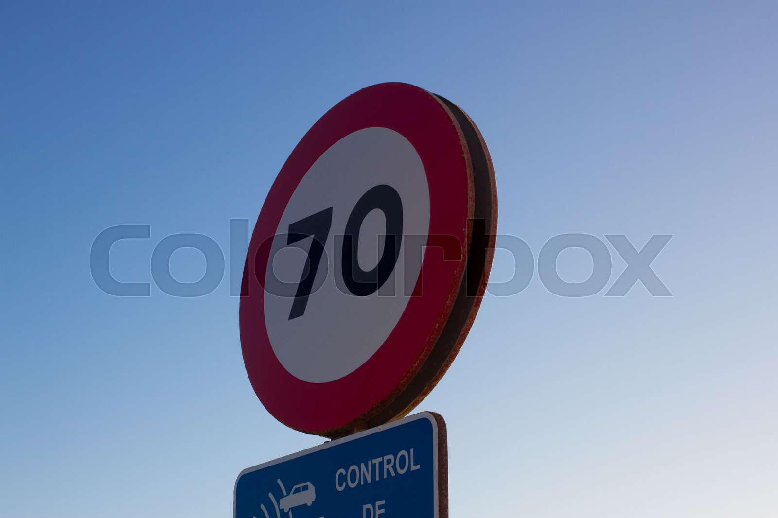 Isolated traffic sign. Seventy miles per hour speed limit sign round ...