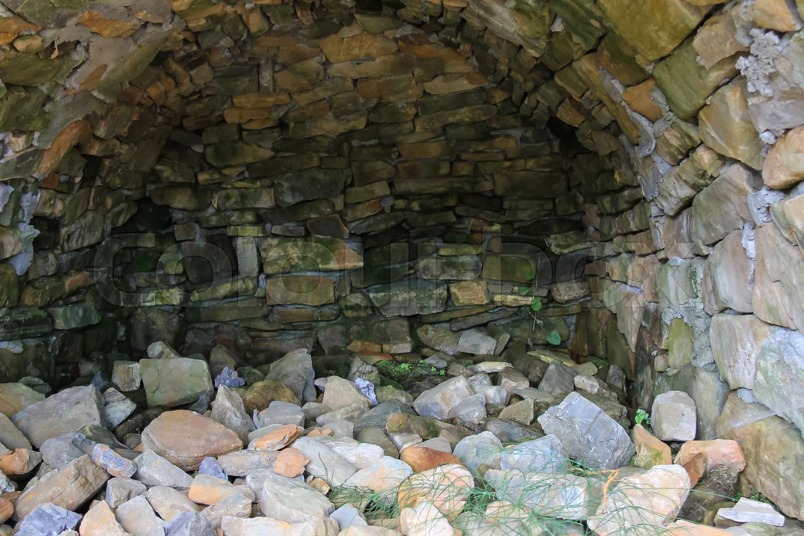 Stone alcove and scattering of stones | Stock image | Colourbox