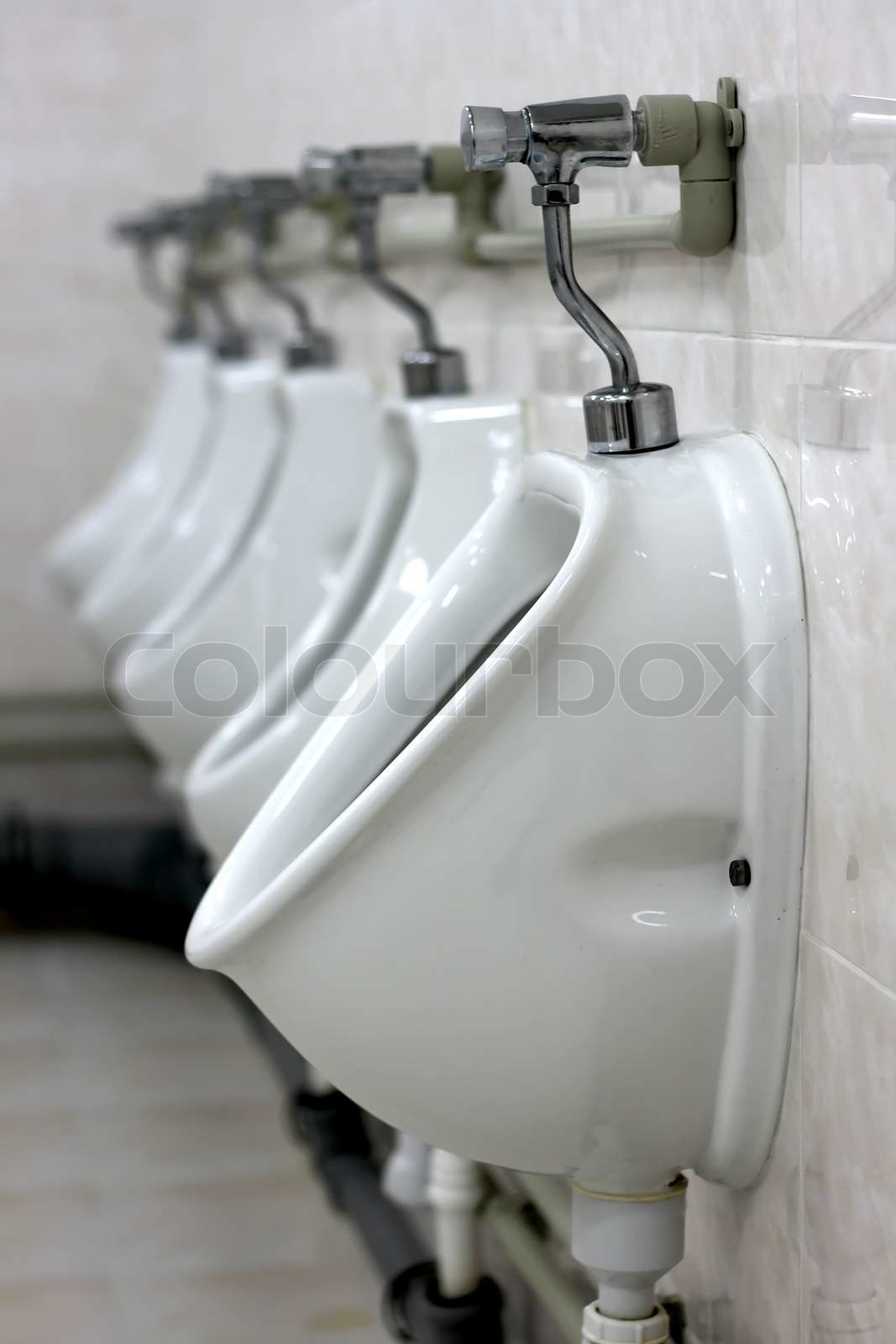 Row of urinals in a public toilet | Stock image | Colourbox