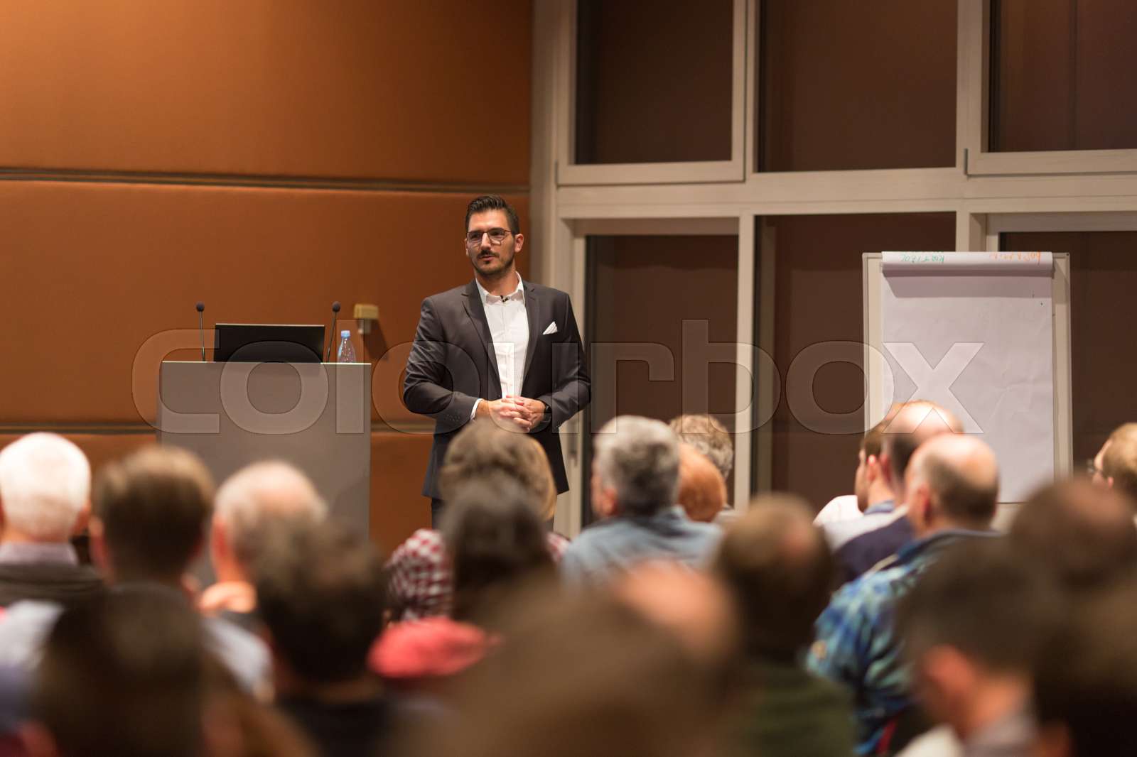 Business speaker giving a talk at conference meeting. | Stock image ...