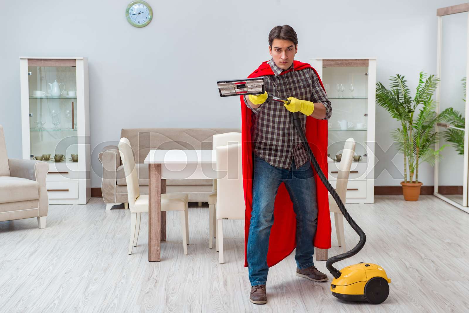 Super hero cleaner working at home | Stock image | Colourbox