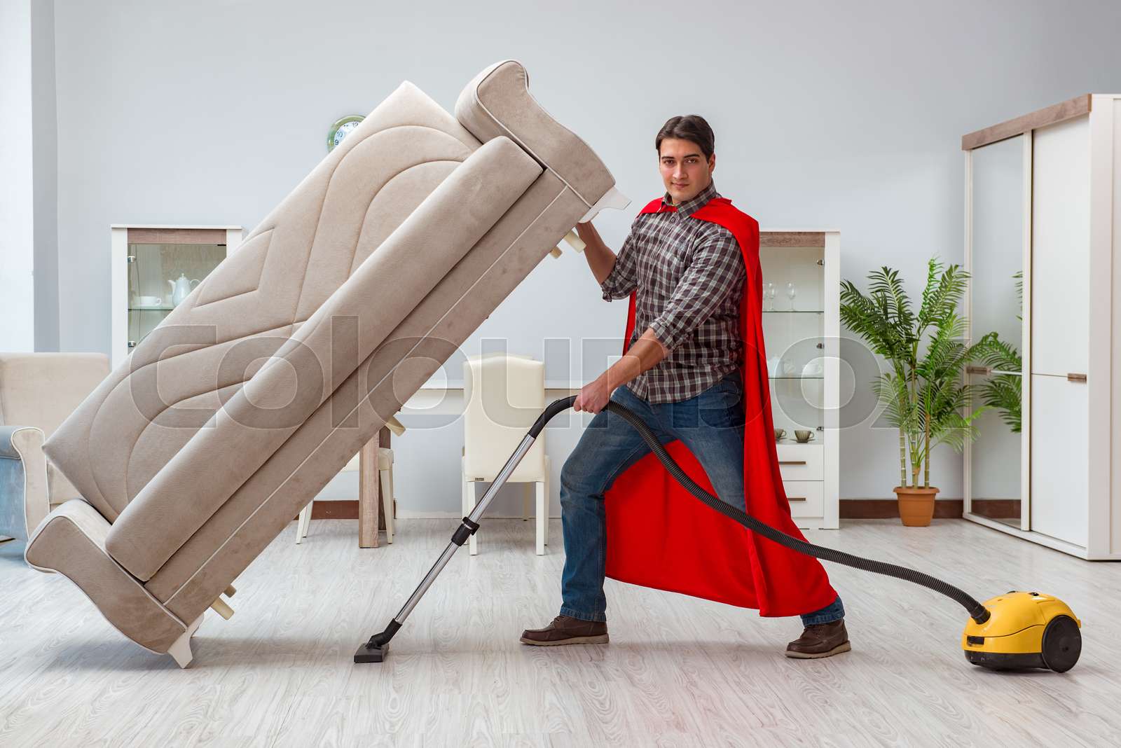 Super hero cleaner working at home | Stock image | Colourbox