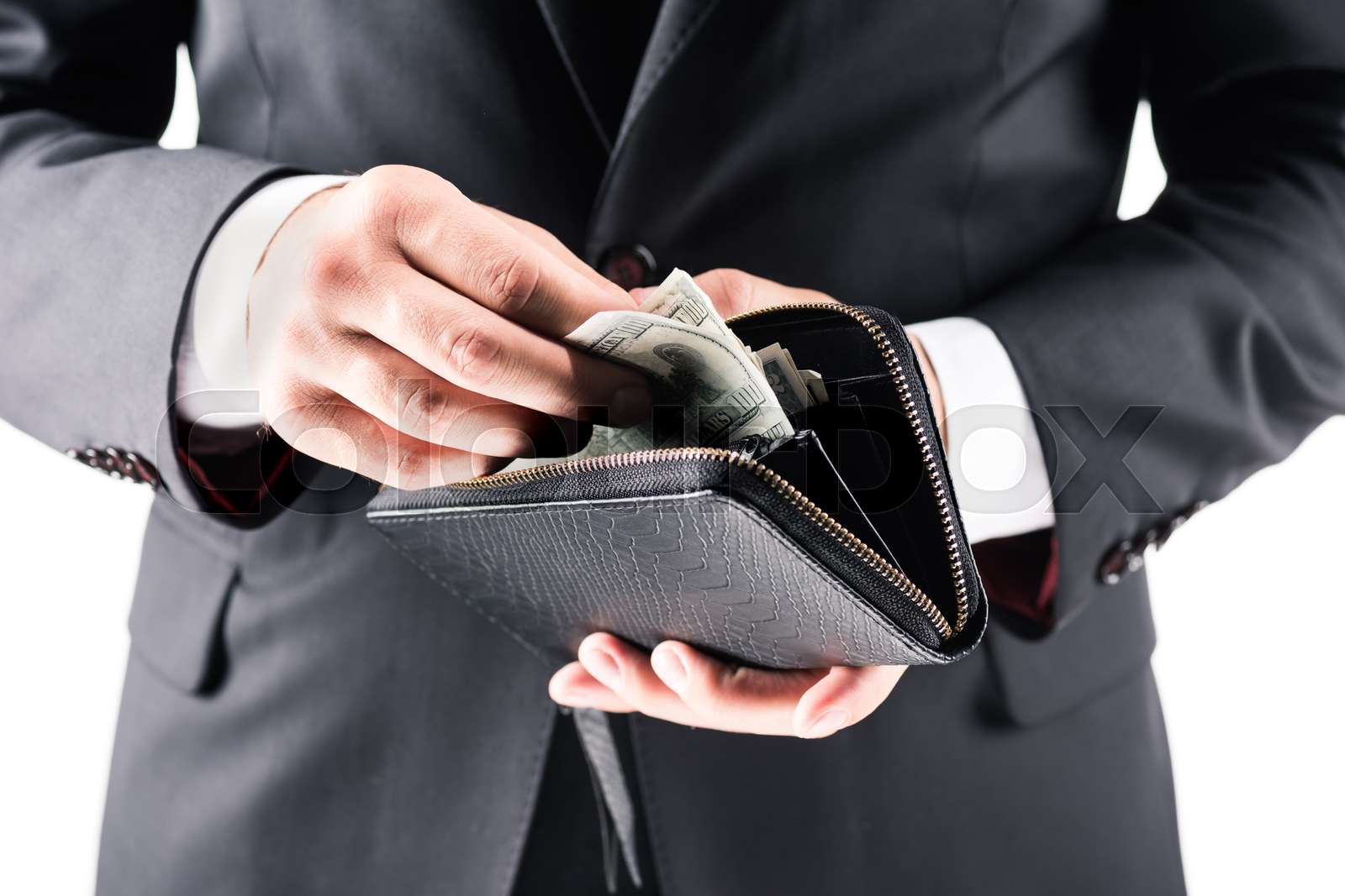 cropped view of businessman in black suit holding wallet with dollar ...