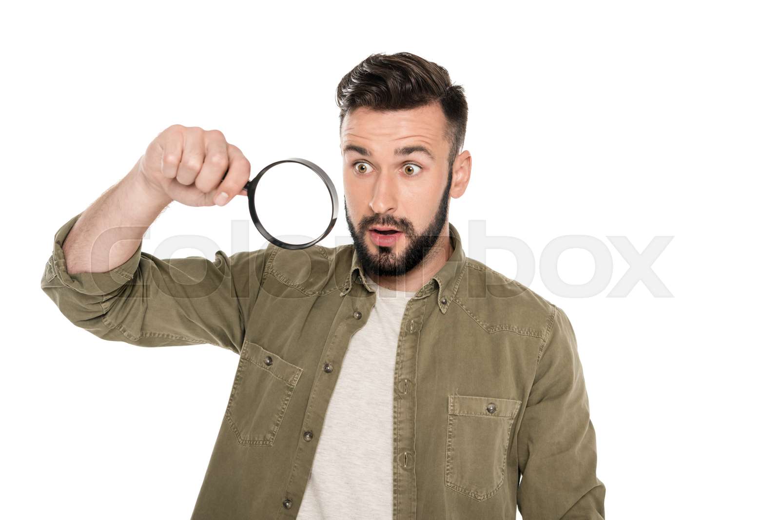 man holding magnifying glass | Stock image | Colourbox