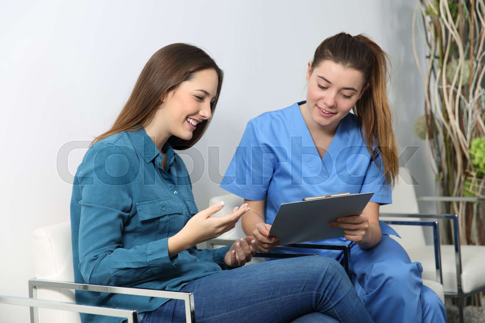 Nurse explaining medical procedure to a patient | Stock image | Colourbox