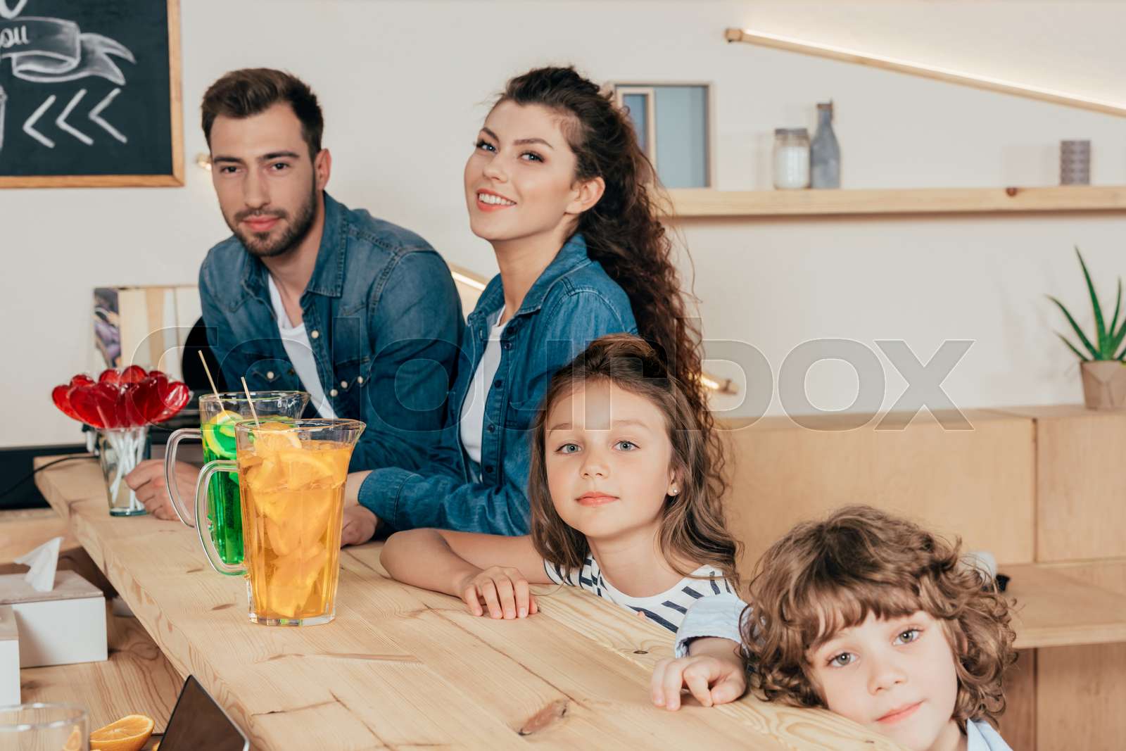 young family at bar counter | Stock image | Colourbox