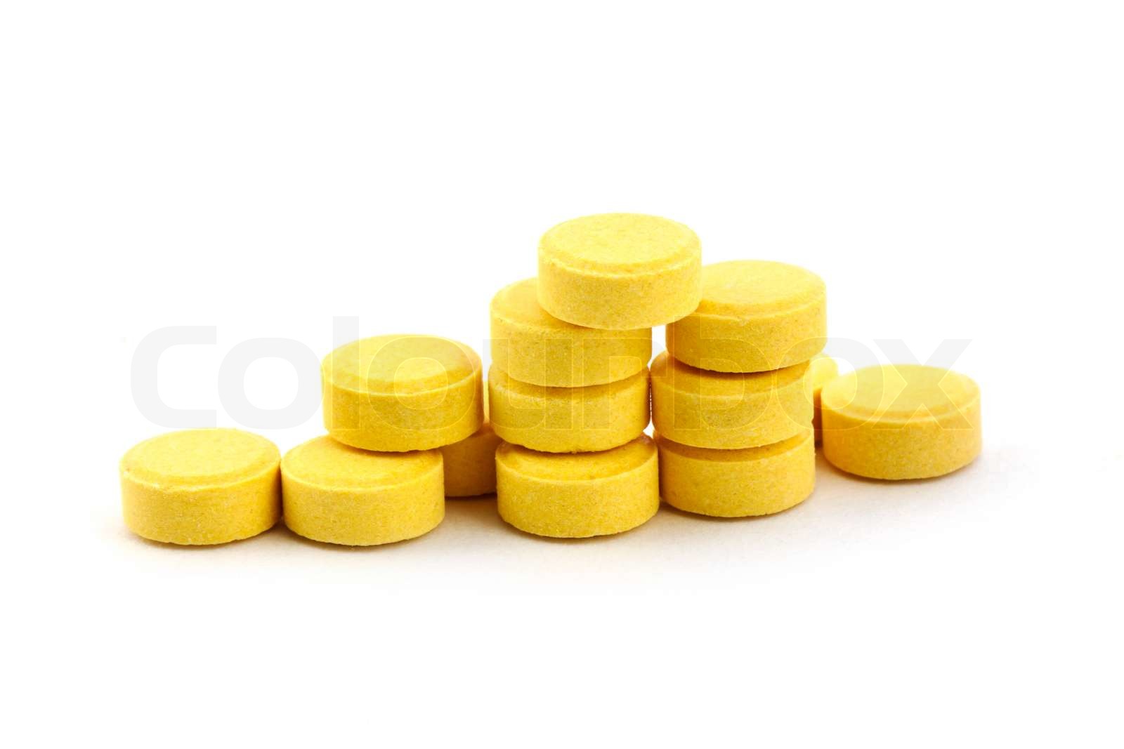 Gule piller isoleret på hvidt | Stock foto | Colourbox