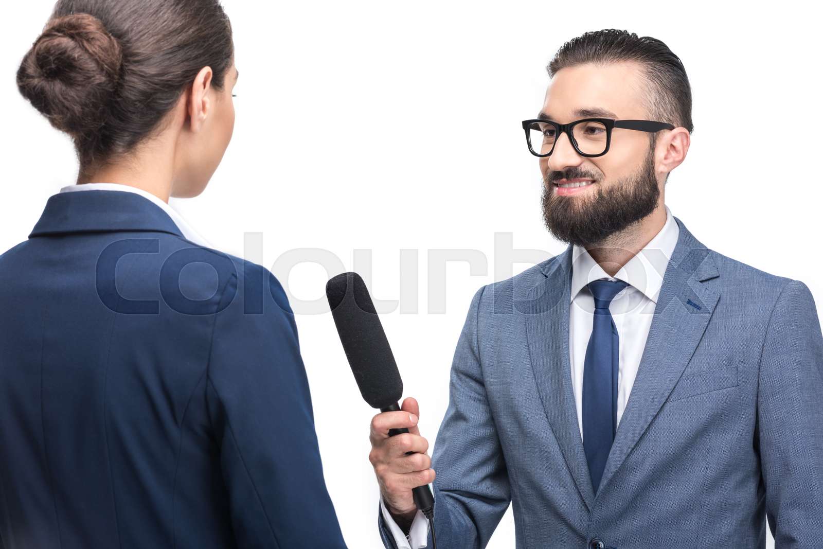 smiling male journalist interviewing businesswoman in suit, isolated on ...