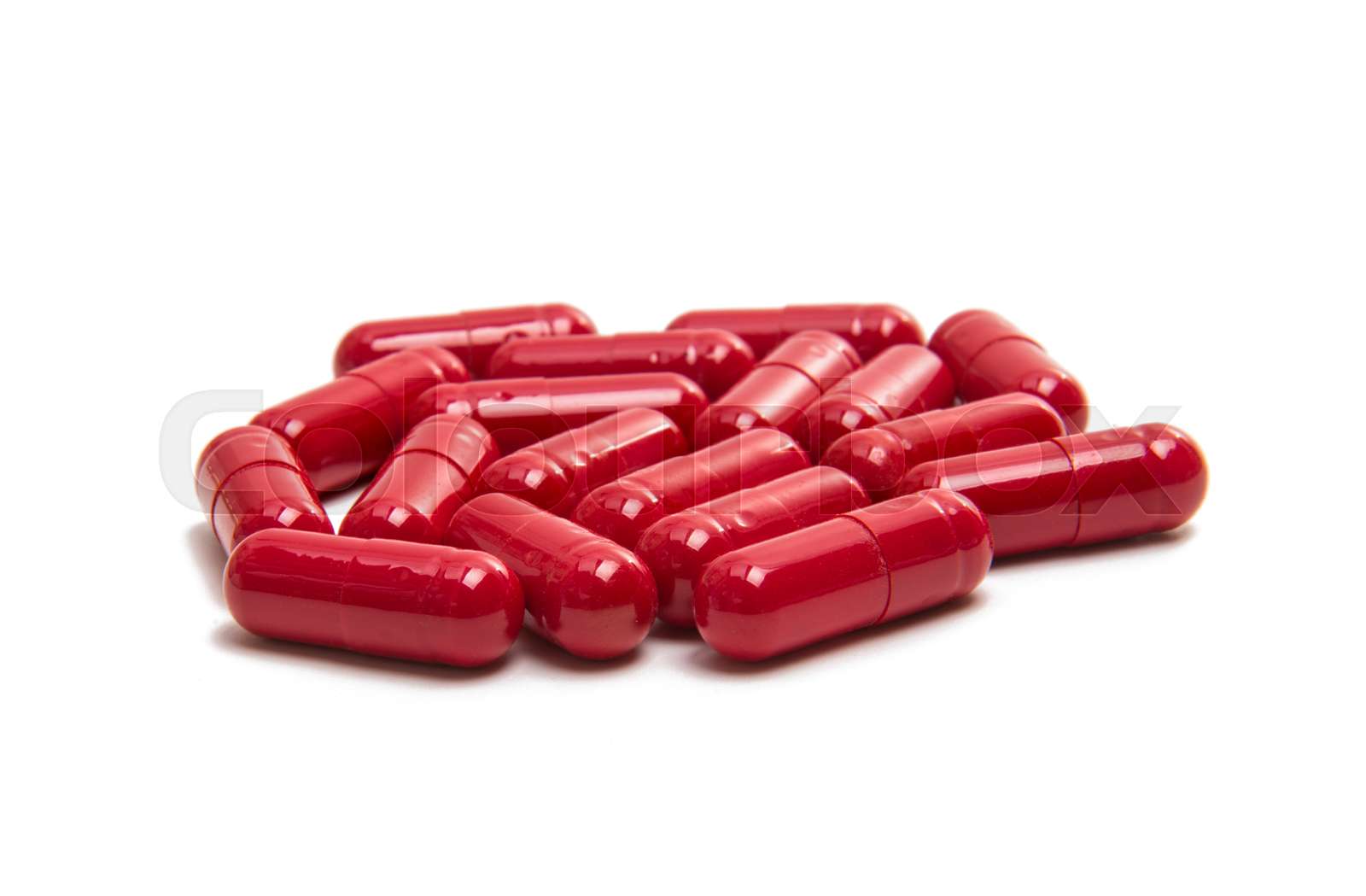 Red capsules isolated | Stock image | Colourbox