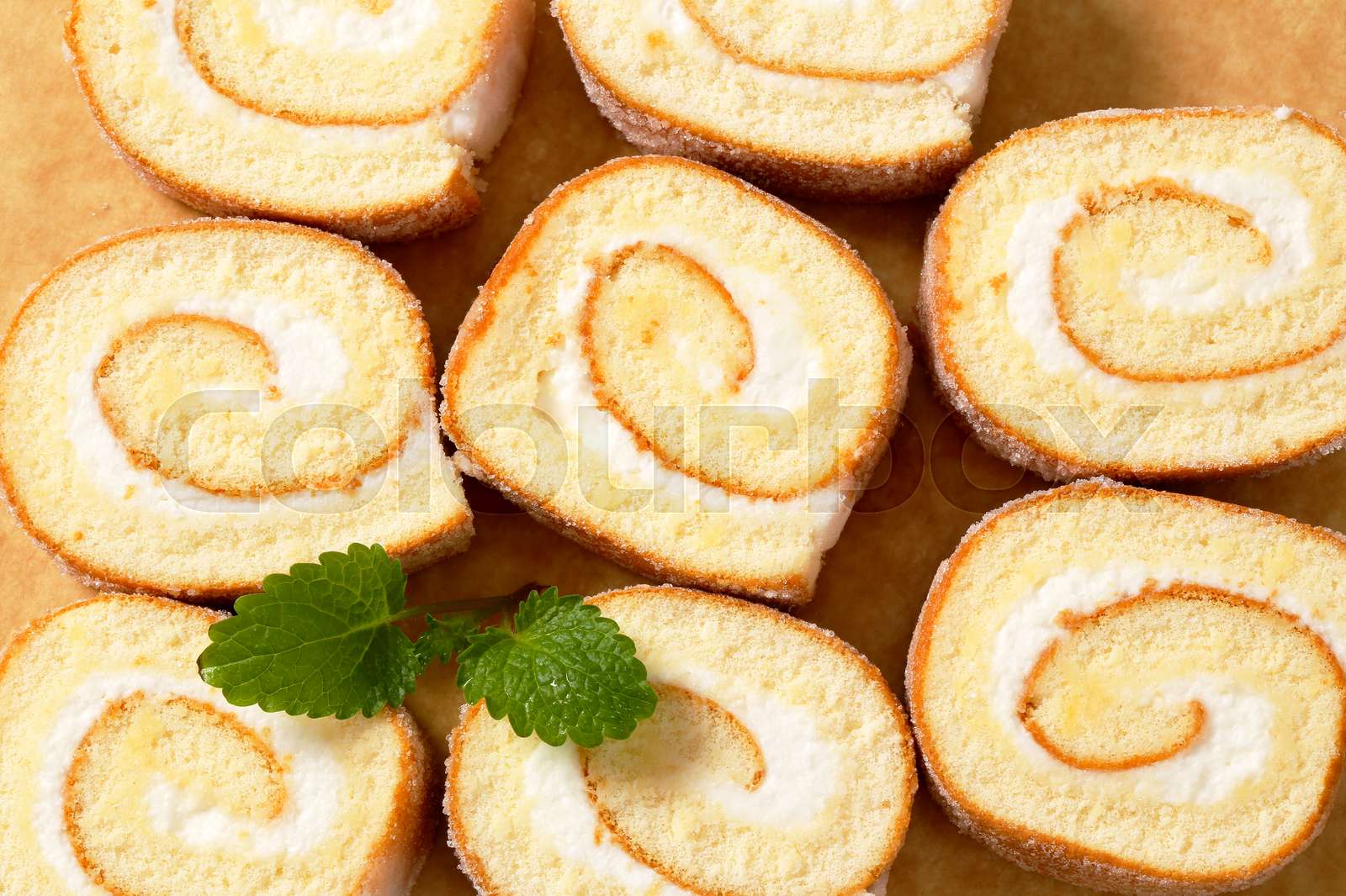 Slices of cream Swiss roll | Stock image | Colourbox