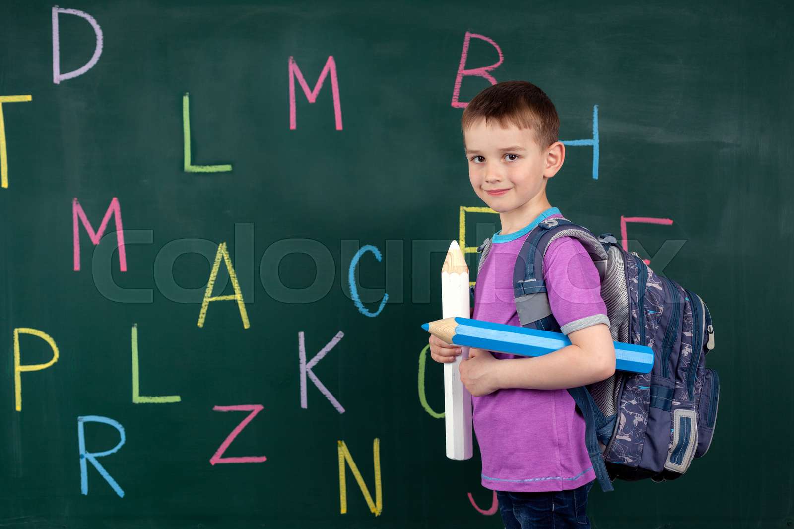 The boy goes to the first class at the school board | Stock image ...