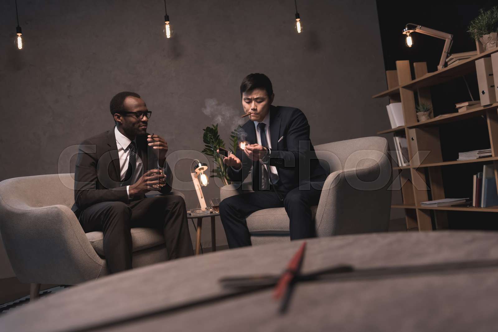 successful multiethic businessmen smoking cigars | Stock image | Colourbox