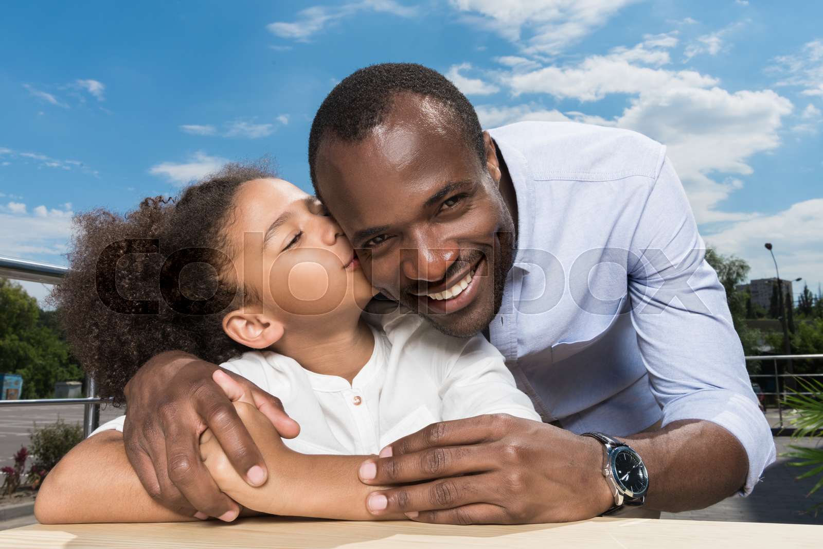 beautiful african-american father and daughter spending time outdoors ...