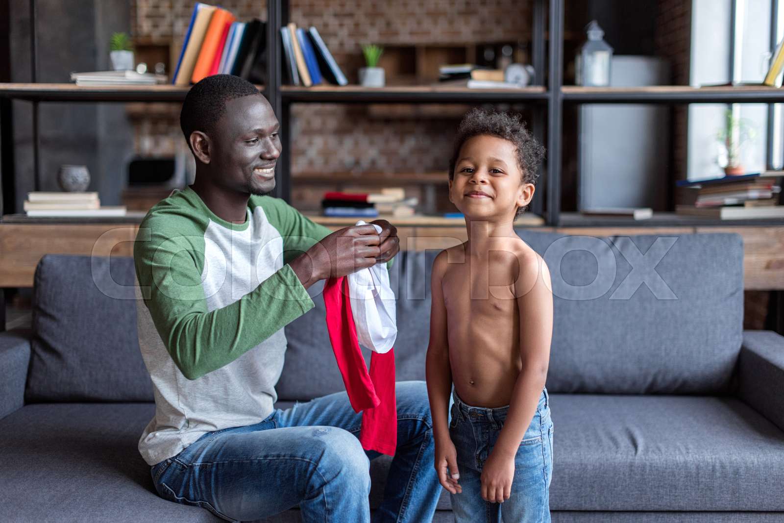 father dressing up his son | Stock image | Colourbox