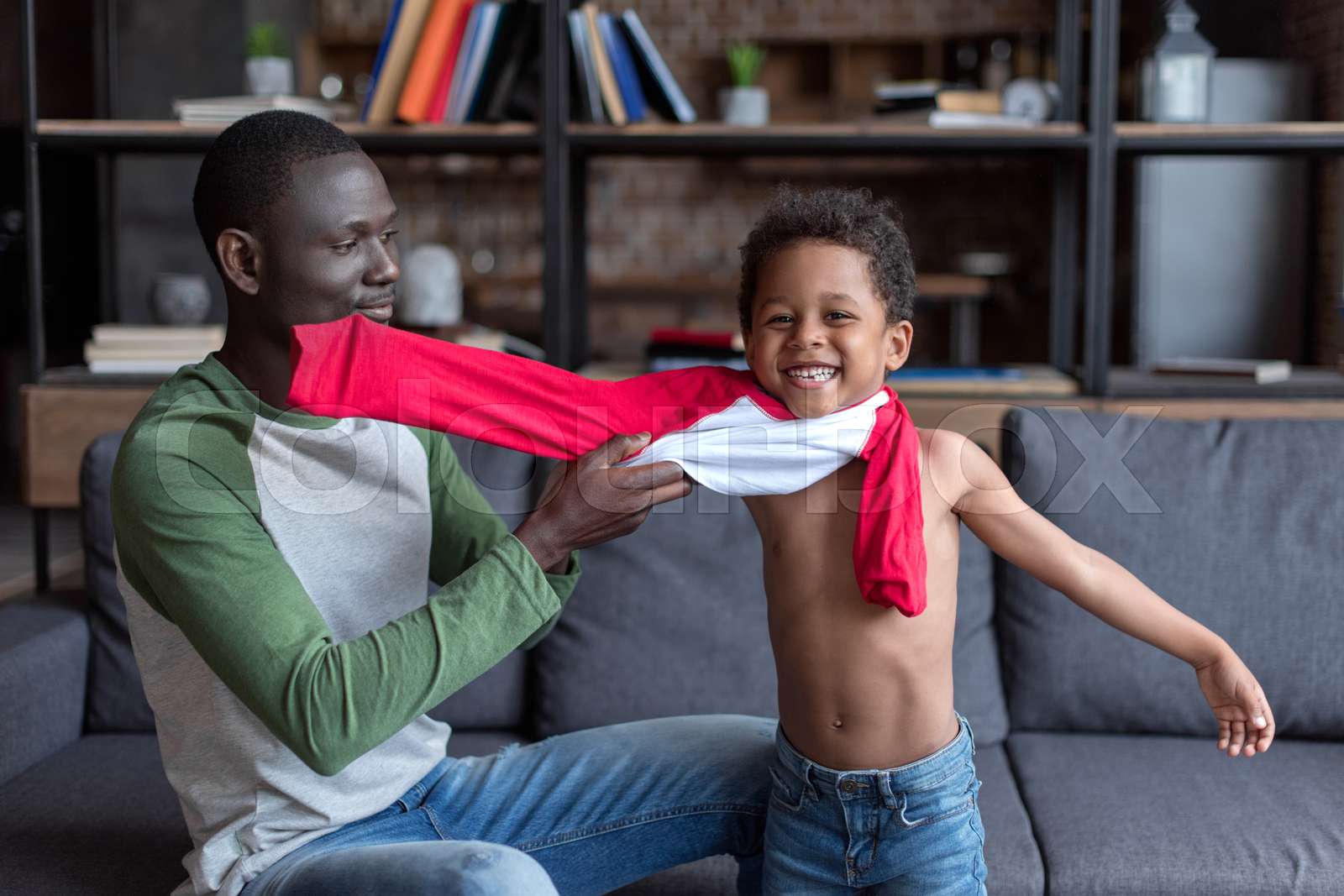 father dressing up his son | Stock image | Colourbox