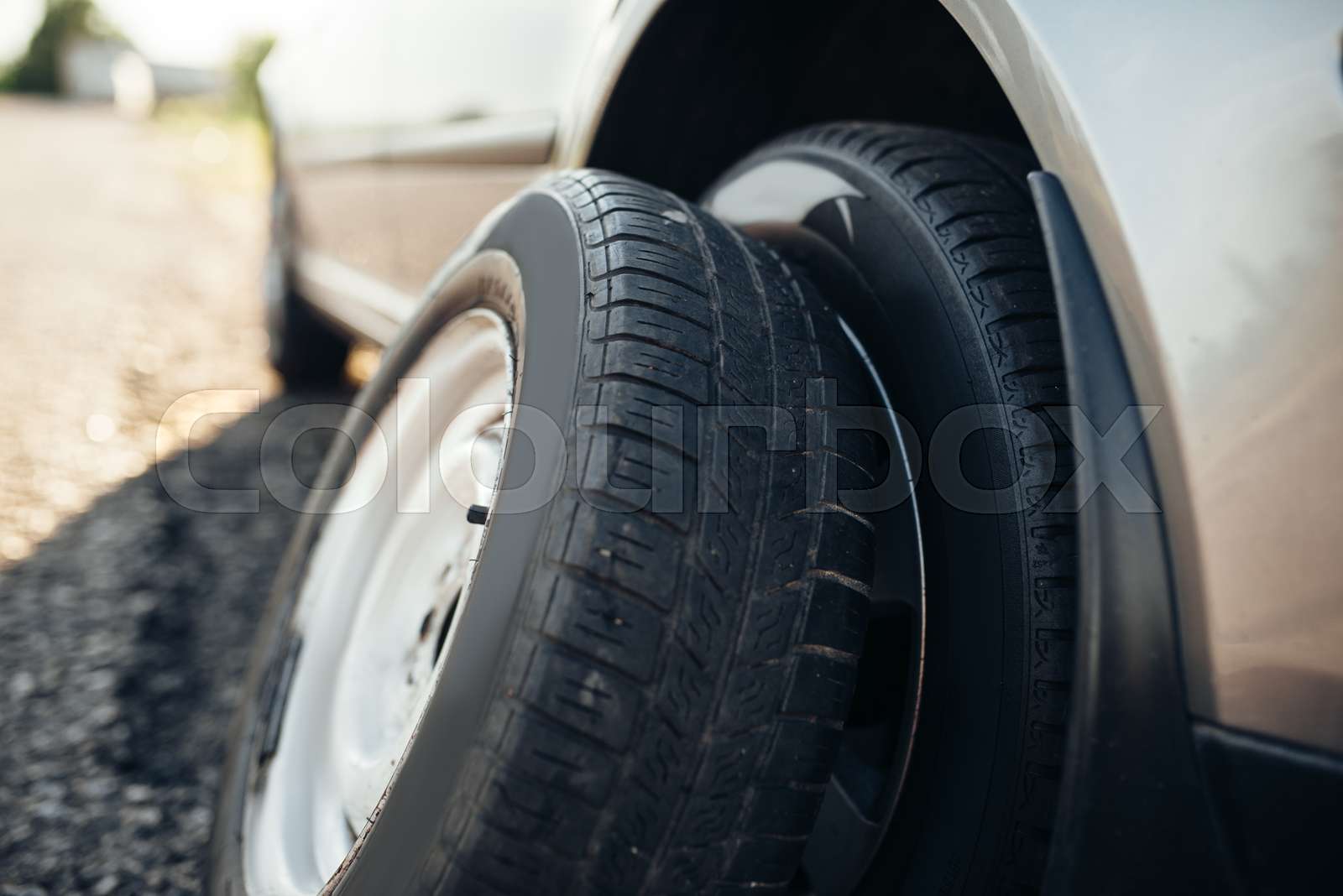 Broken car concept, spare wheel replacement | Stock image | Colourbox