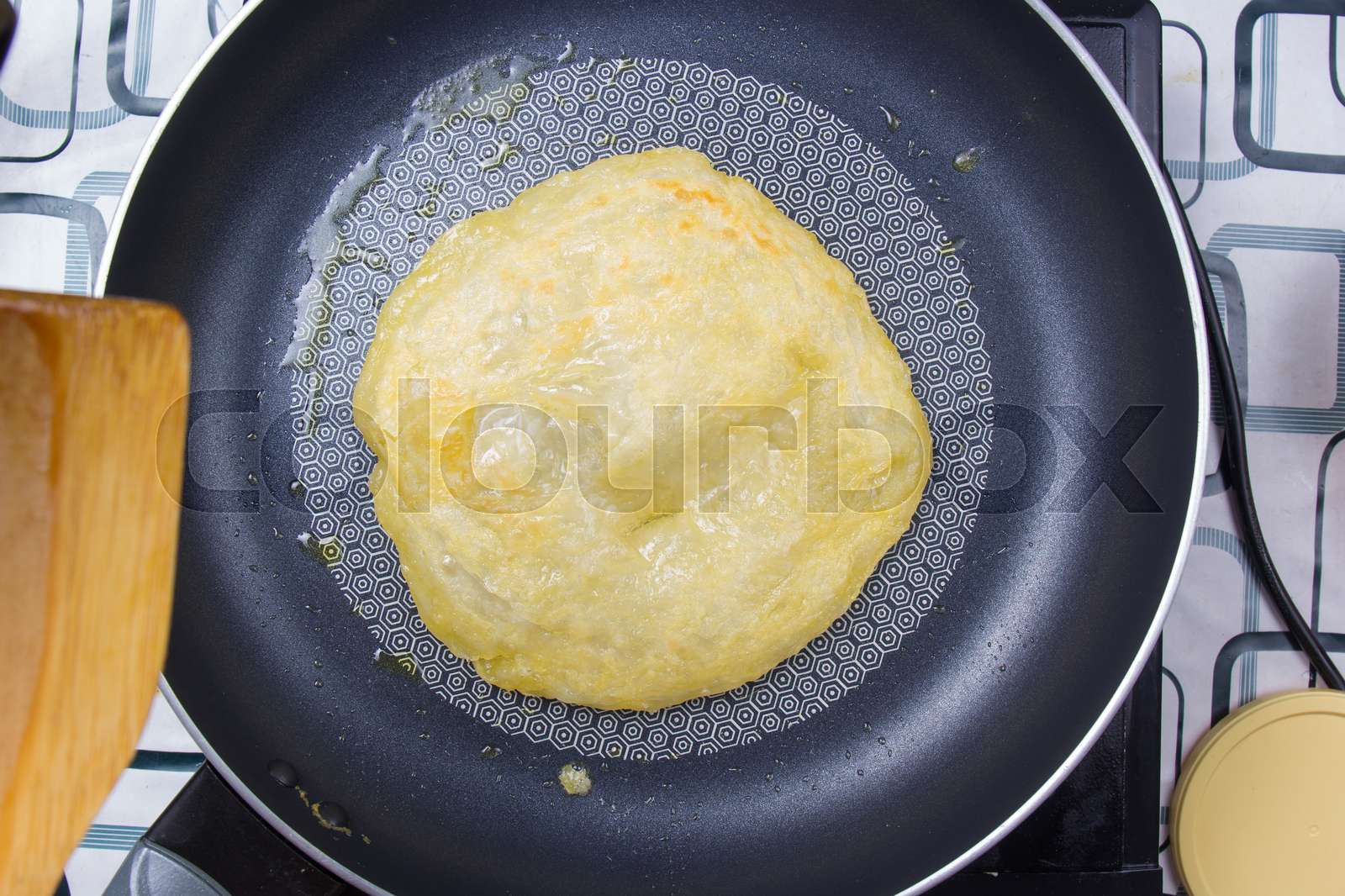 Chef cooking roti in the pan home mate style | Stock image | Colourbox
