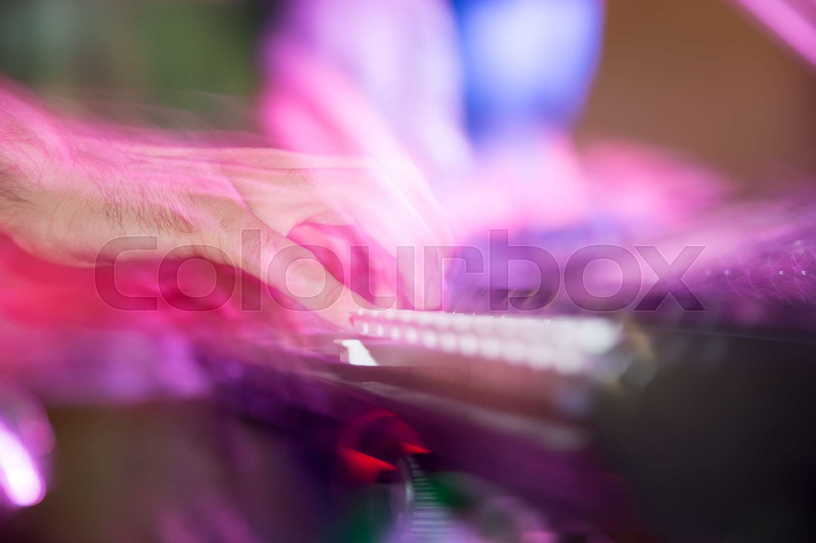 Musician plays keyboards in a rock band | Stock image | Colourbox
