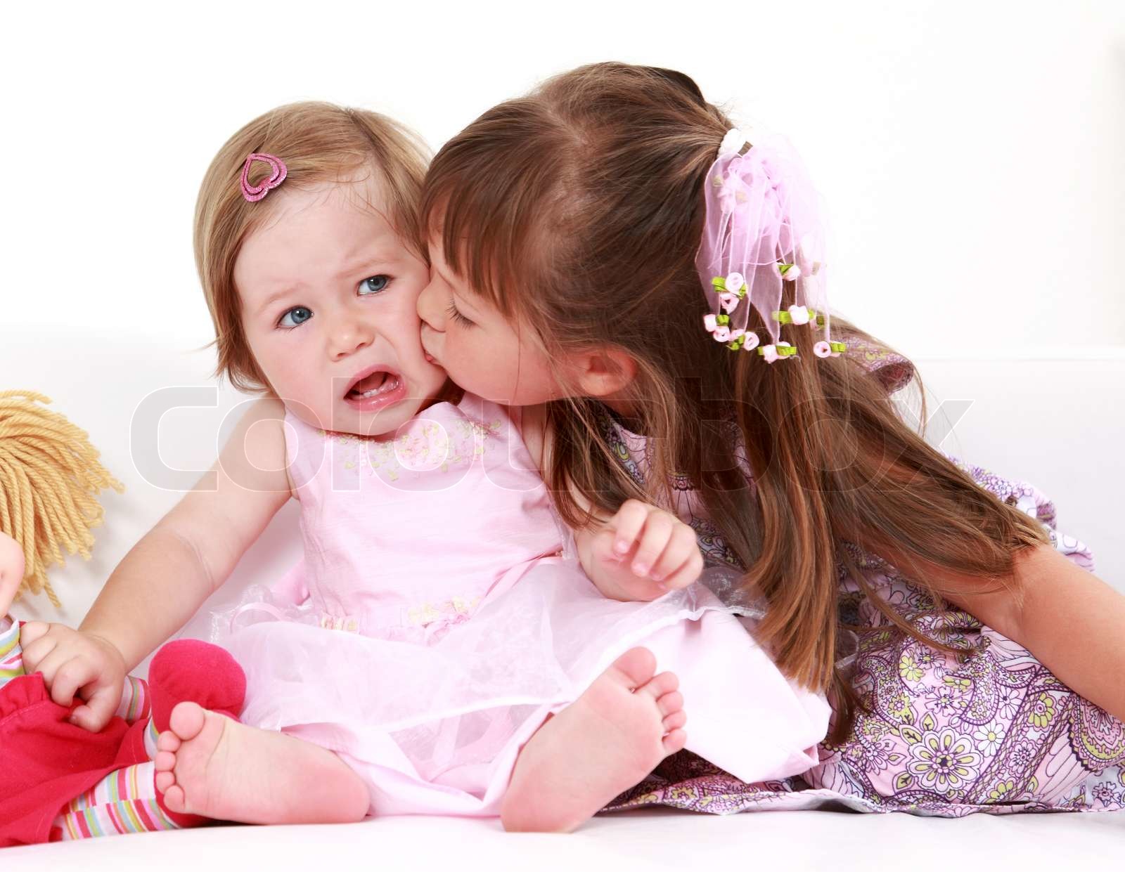Kids giving a kiss to each other | Stock image | Colourbox